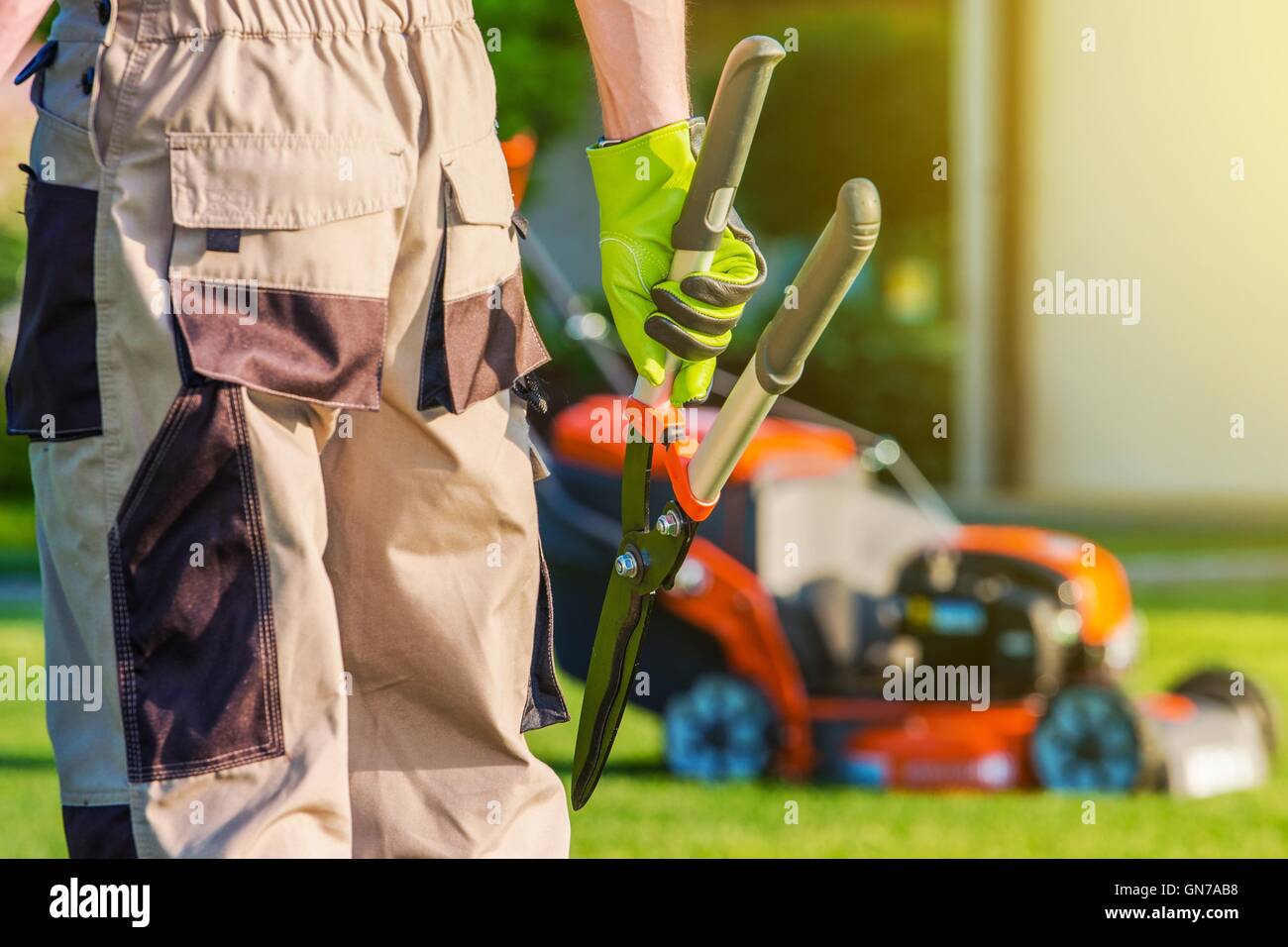 Landscaping Professional. Pro Gardener with Large Scissors and Other ...