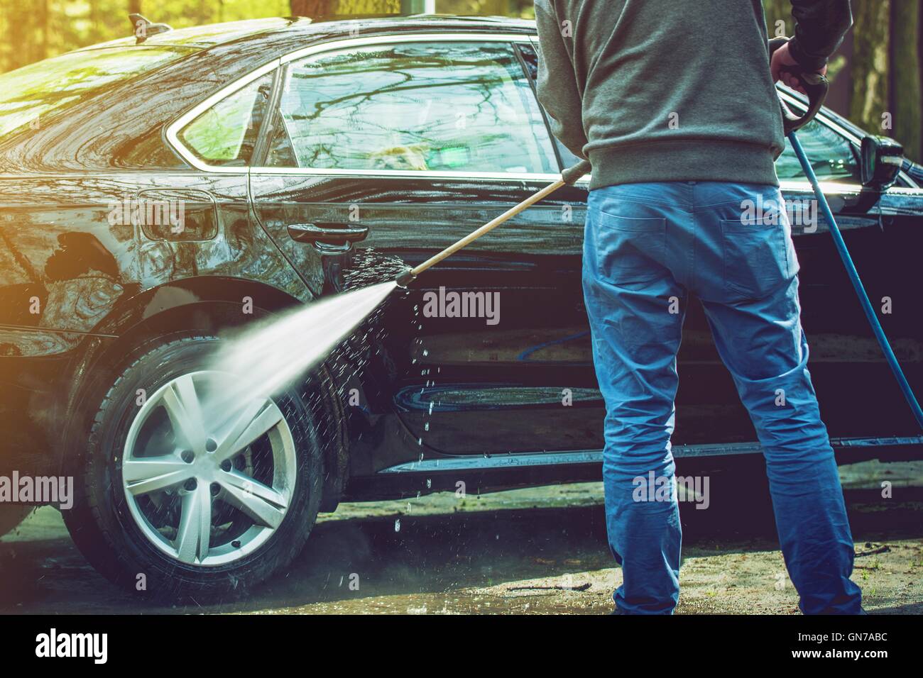 Men Cleaning His Modern Car. Outdoor Car Washing by High Pressured ...