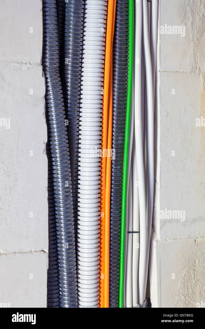Cables and pipes in the wall Stock Photo - Alamy