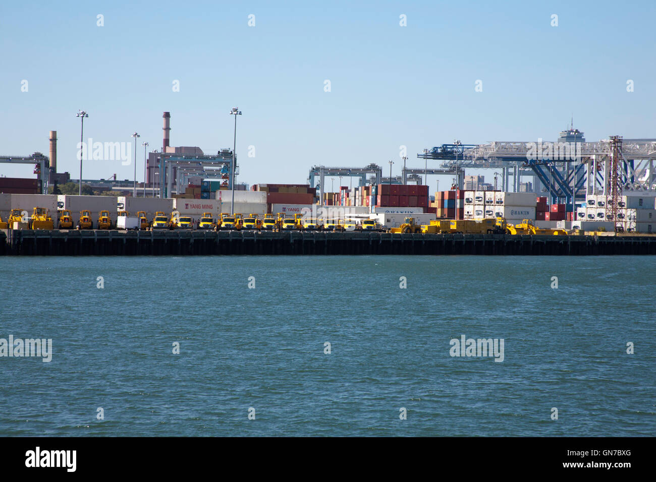 Yellow trucks and cranes by The Reserved Channel Seaport District ...