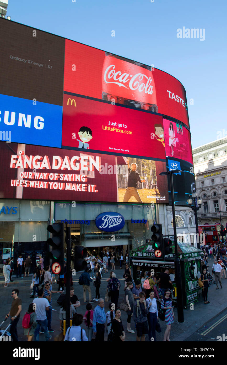 Piccadilly Circus road junction, Neon signs and public space of London ...