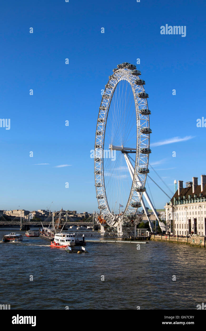 The London Eye giant Ferris wheel on the South Bank of the River Thames ...