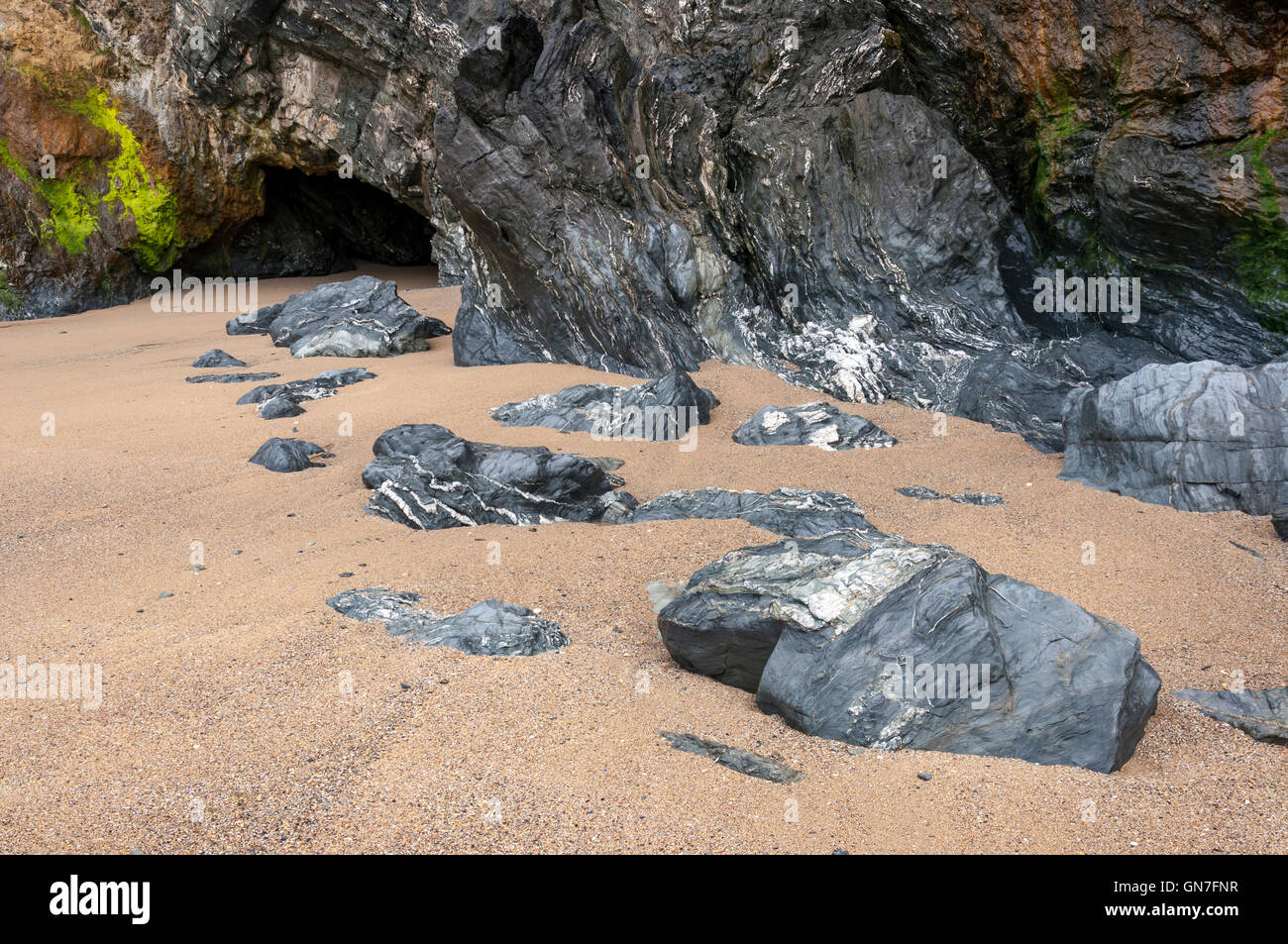 A cave and interesting rocks at Holywell Bay on the coast of Cornwall ...