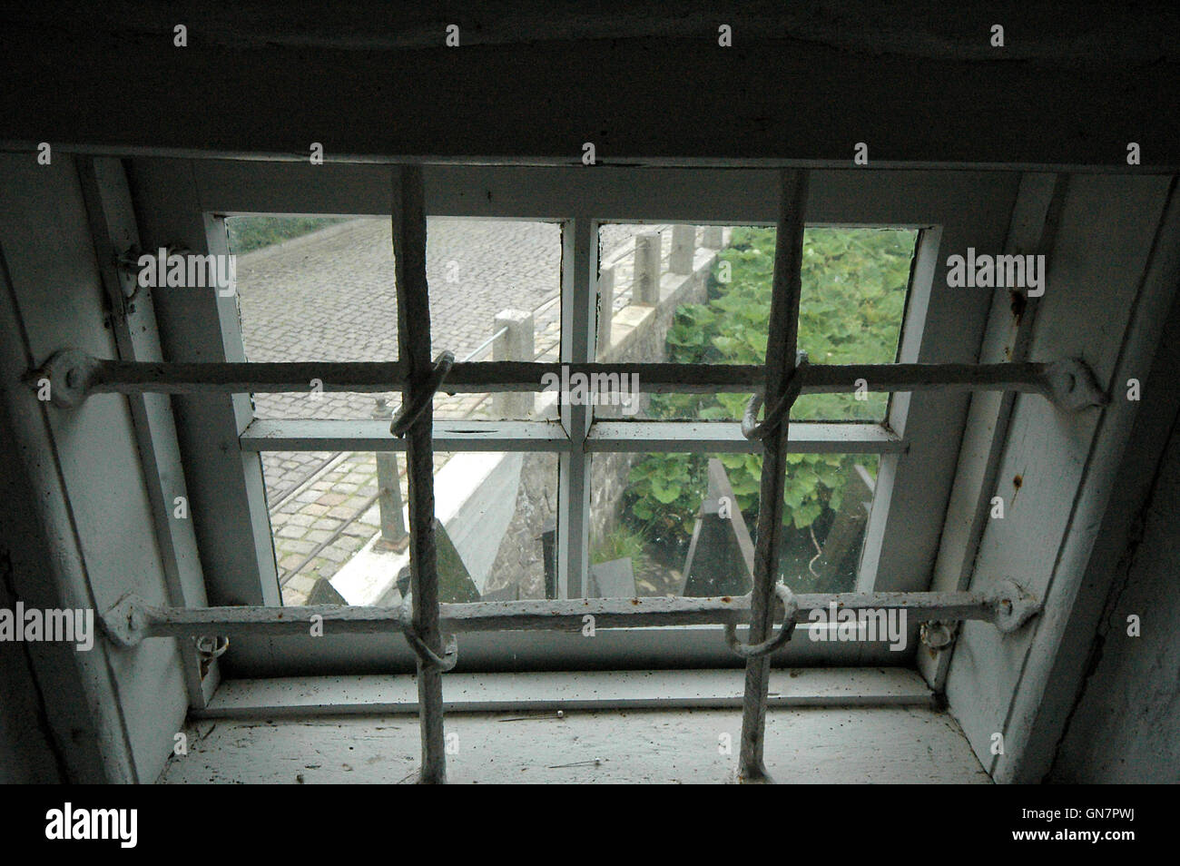 Barred window in old water mill Stock Photo - Alamy