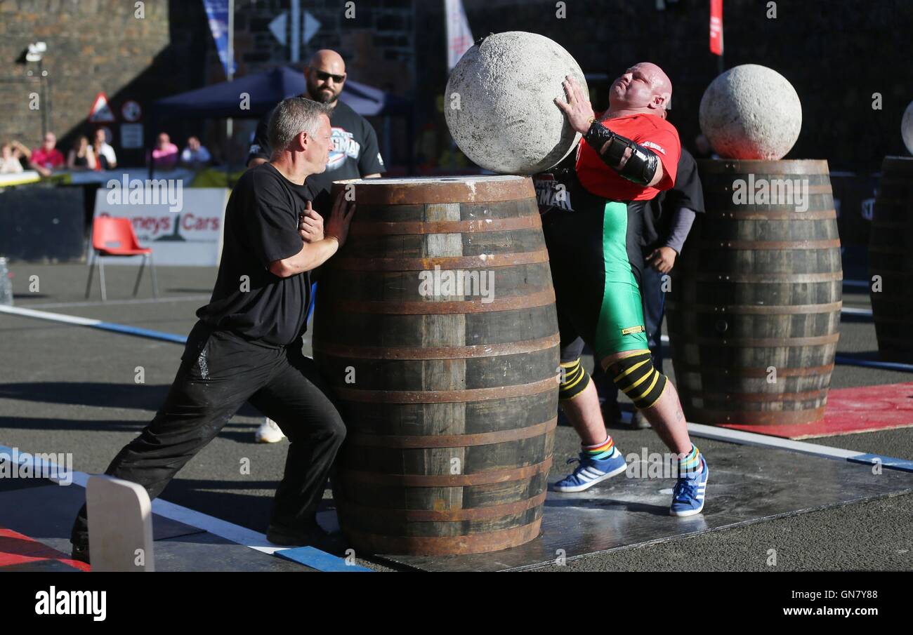 Belfast's Phil Morgan competes in the Stones of Strength round during ...