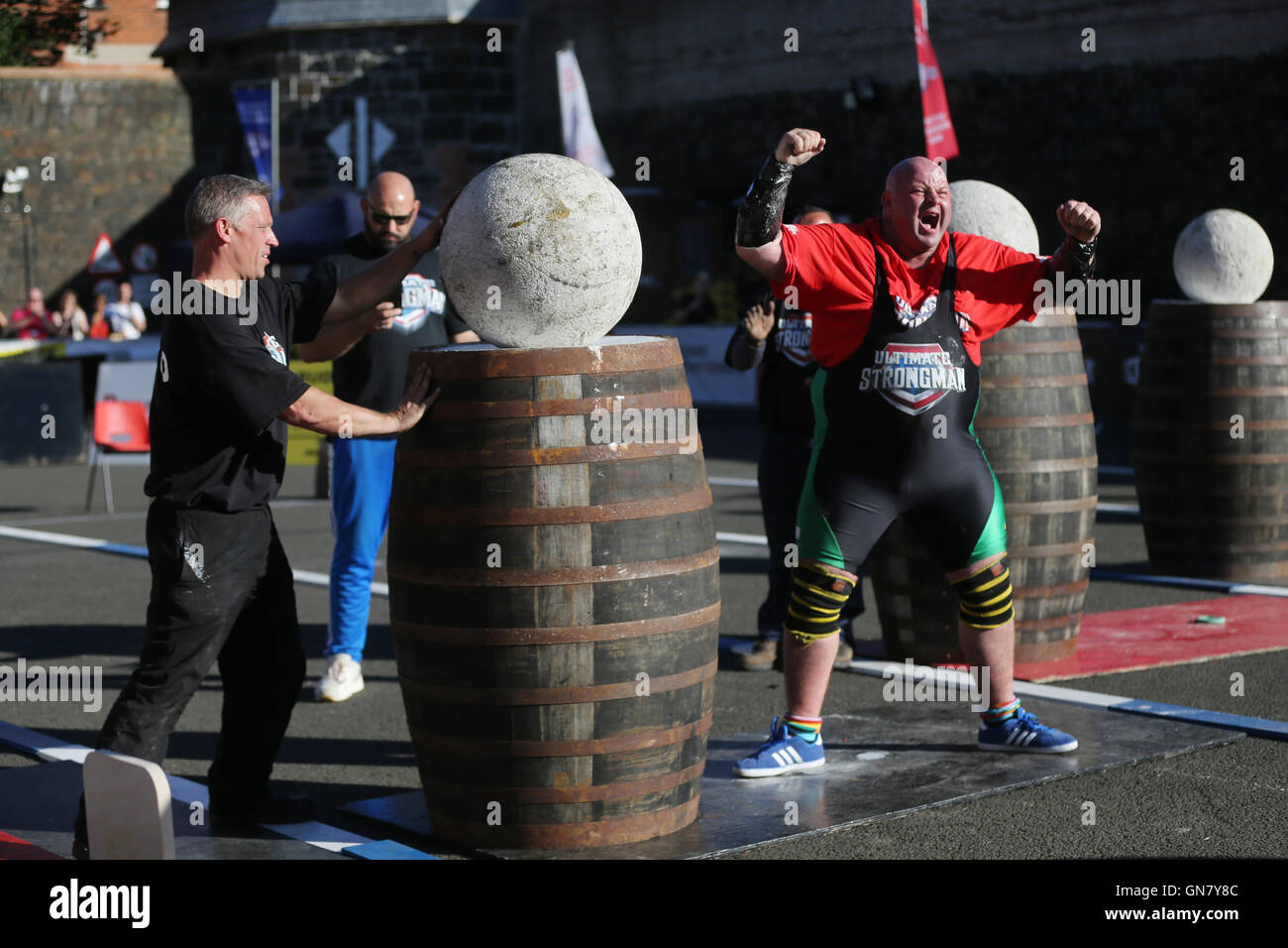 Belfast's Phil Morgan celebrates his victory in the Stones of Strength ...
