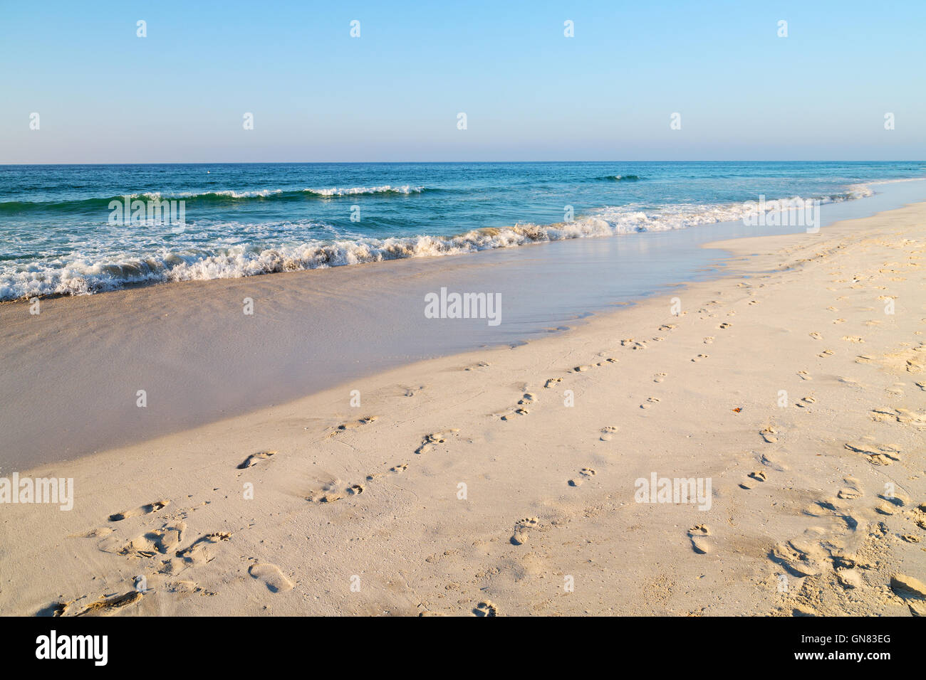 near sandy beach sky and mountain in oman arabic sea Stock Photo - Alamy