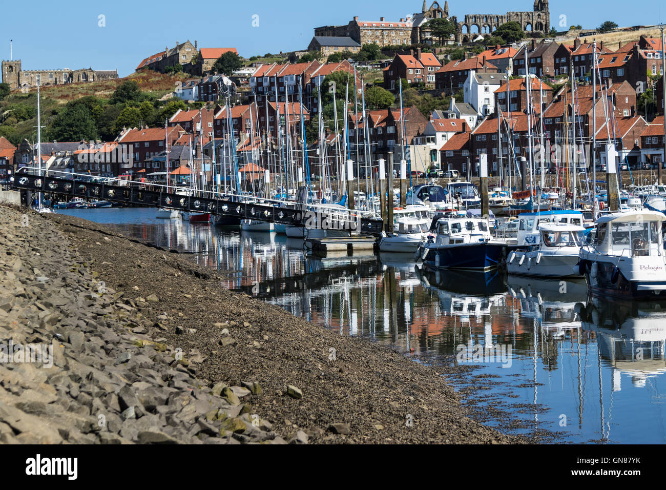 Boats in Whitby Harbour and Whitby Castle in background Stock Photo - Alamy