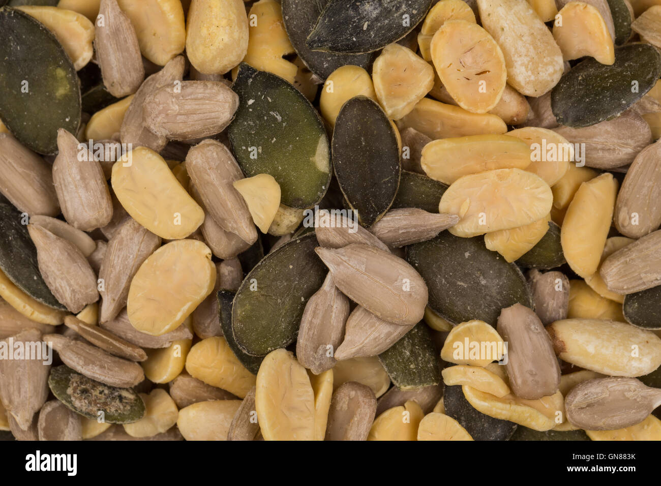 mixed seeds and nuts close up on dark background Stock Photo - Alamy