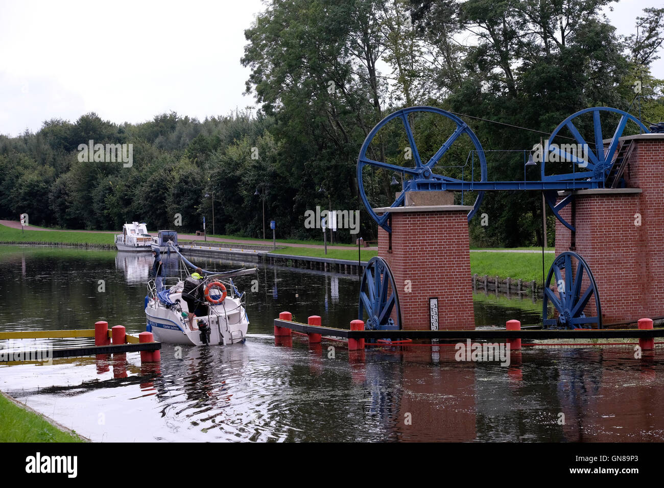 Boat pass through water lock at Buczyniec in Elbag canal in Warmian ...