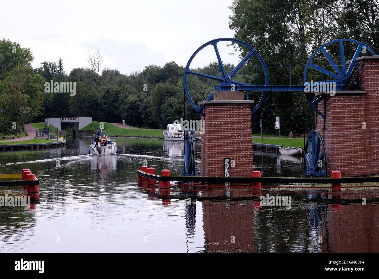 Boat pass through water lock at Buczyniec in Elbag canal in Warmian ...