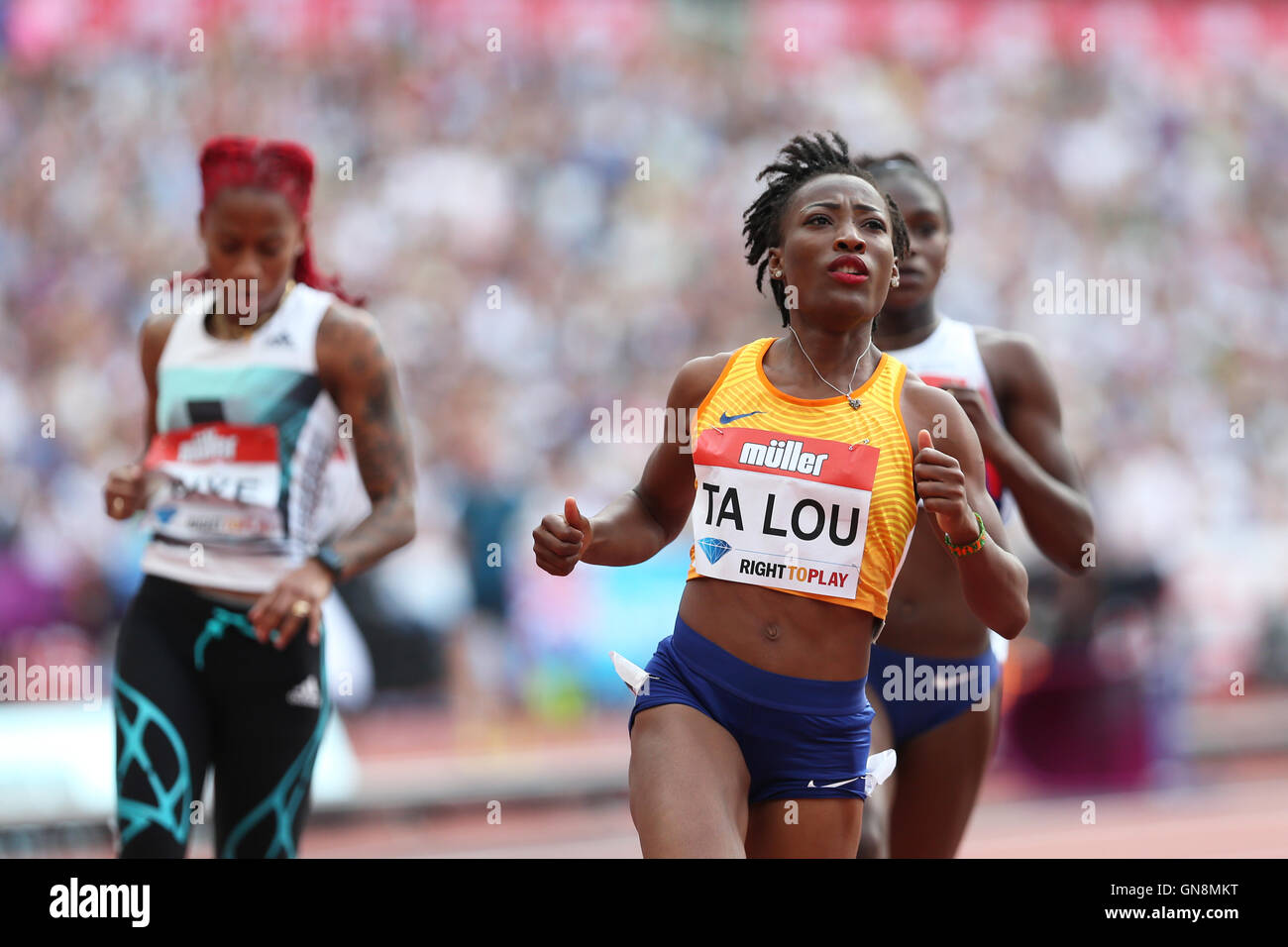 Marie-Josee TA LOU crossing the finish line in the Women's 100m Heat 2 ...