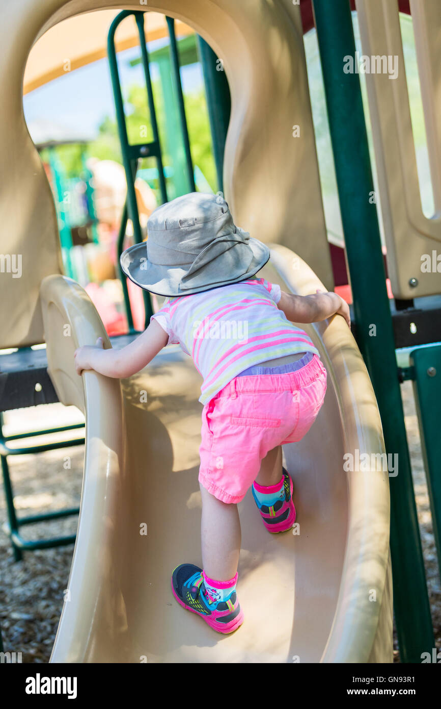 Toddler playing at outdoor playground Stock Photo - Alamy