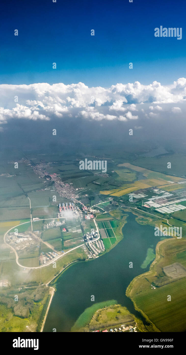 aerial view of reservoir and fields under clouds and blue sky Stock ...