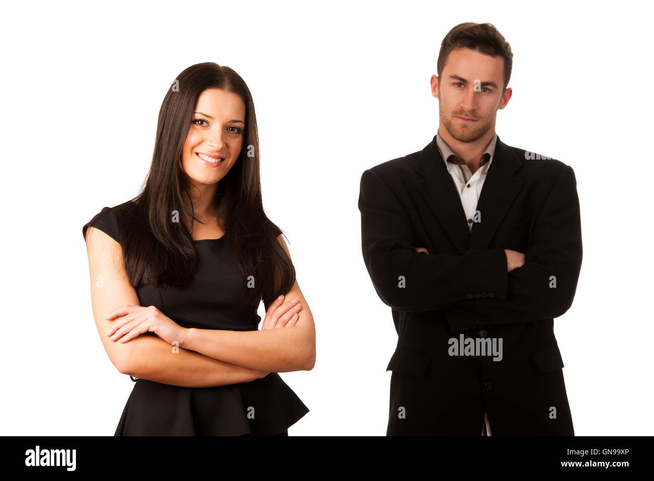 Confident business couple standing one behind the other as a sign of ...