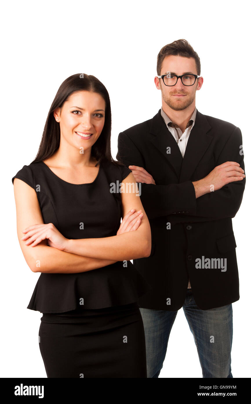 Confident business couple standing one behind the other as a sign of ...