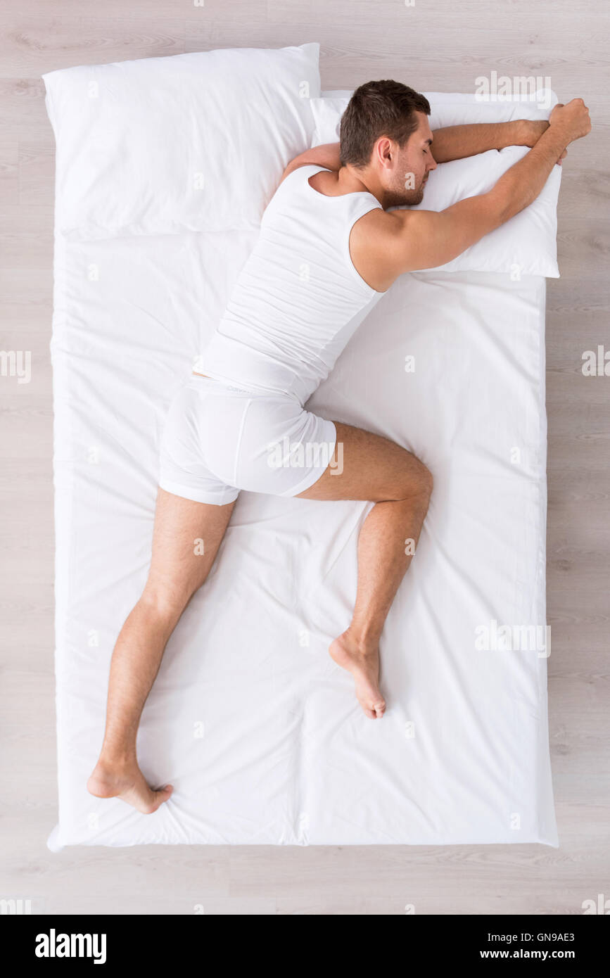 Man lying on bed hi-res stock photography and images - Alamy