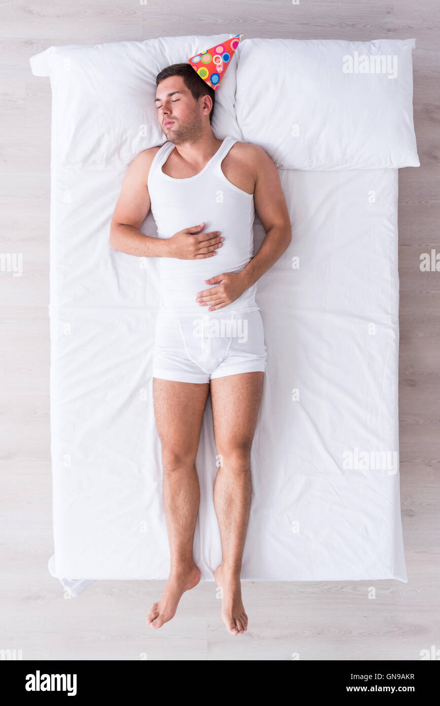 Man sleeping on bed hi-res stock photography and images - Alamy