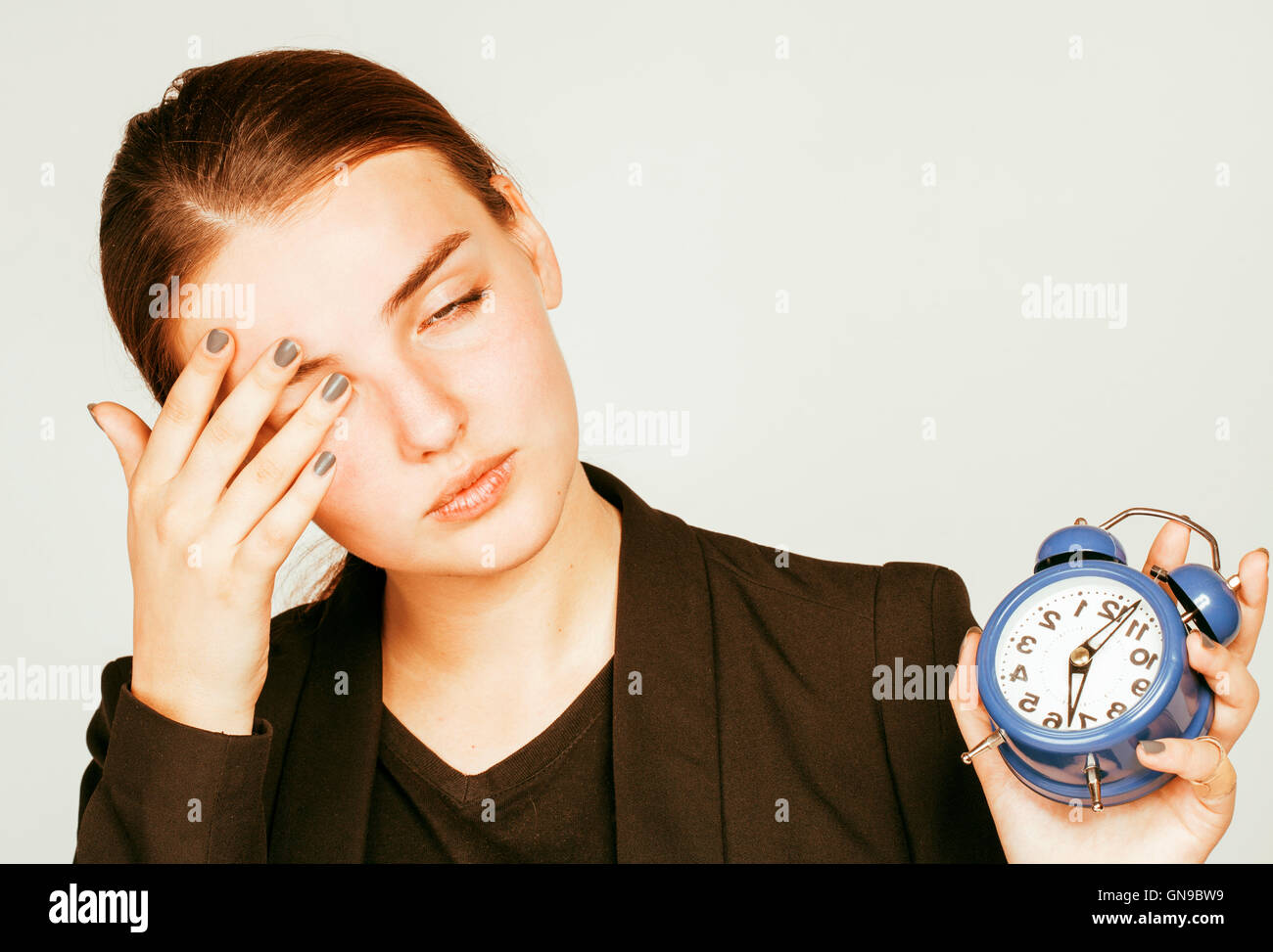 young beauty woman in business style costume waking up for work early ...