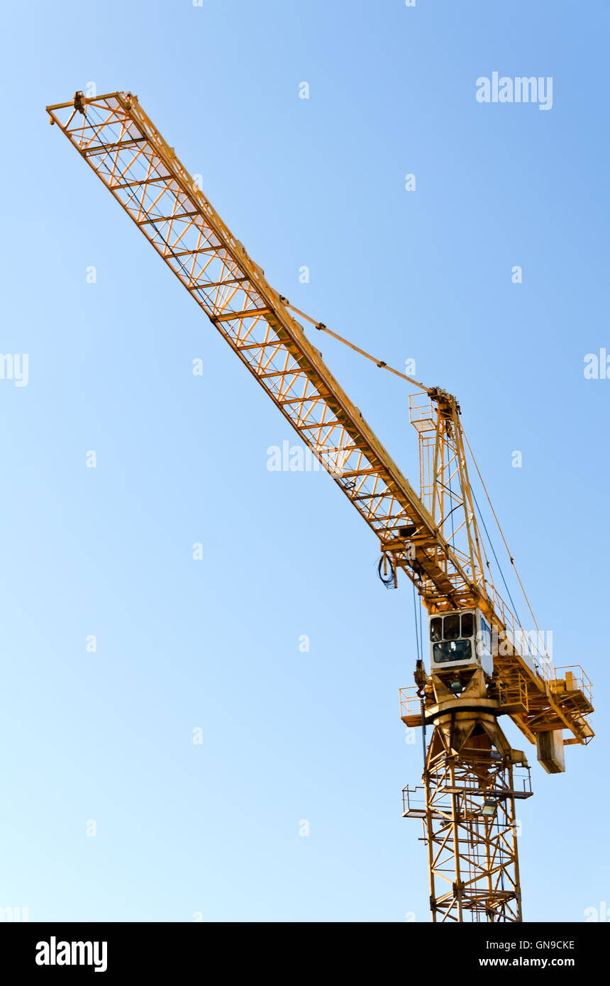 Boom of Tower crane against blue sky Stock Photo - Alamy