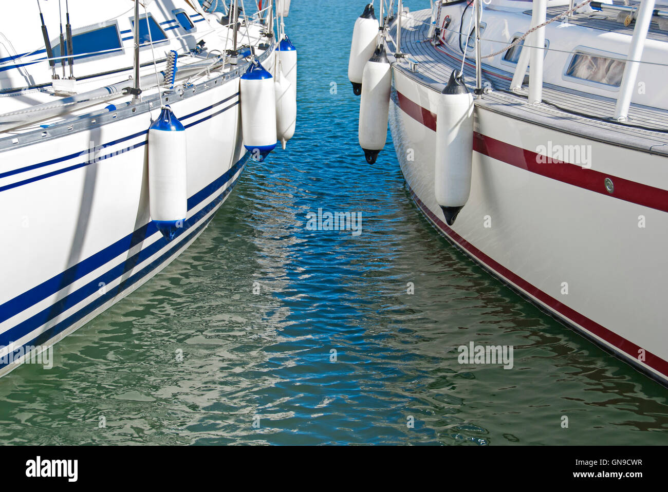 Colorful motorboats on calm water Stock Photo - Alamy