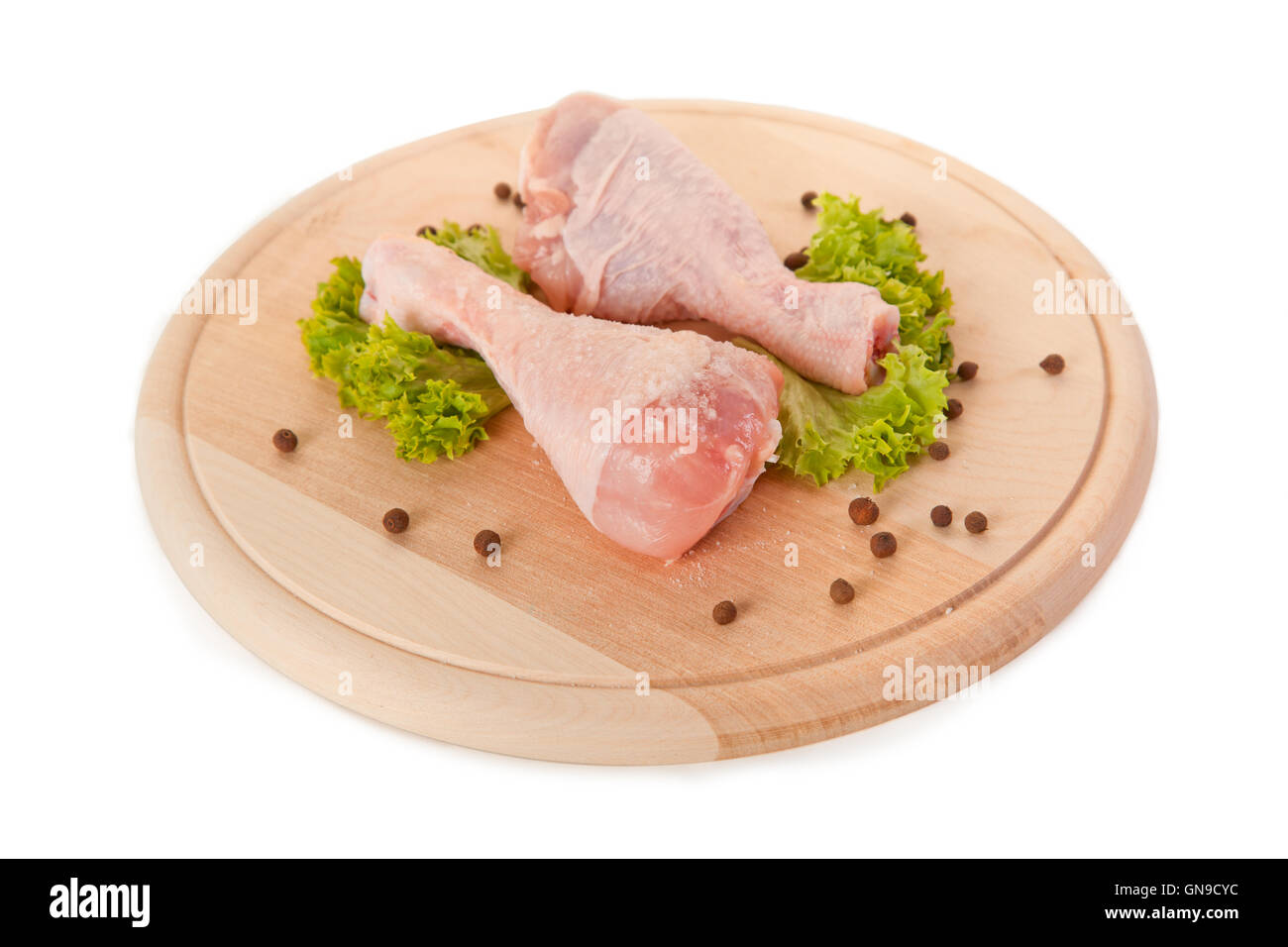 Fresh raw chicken legs isolated on white background Stock Photo - Alamy