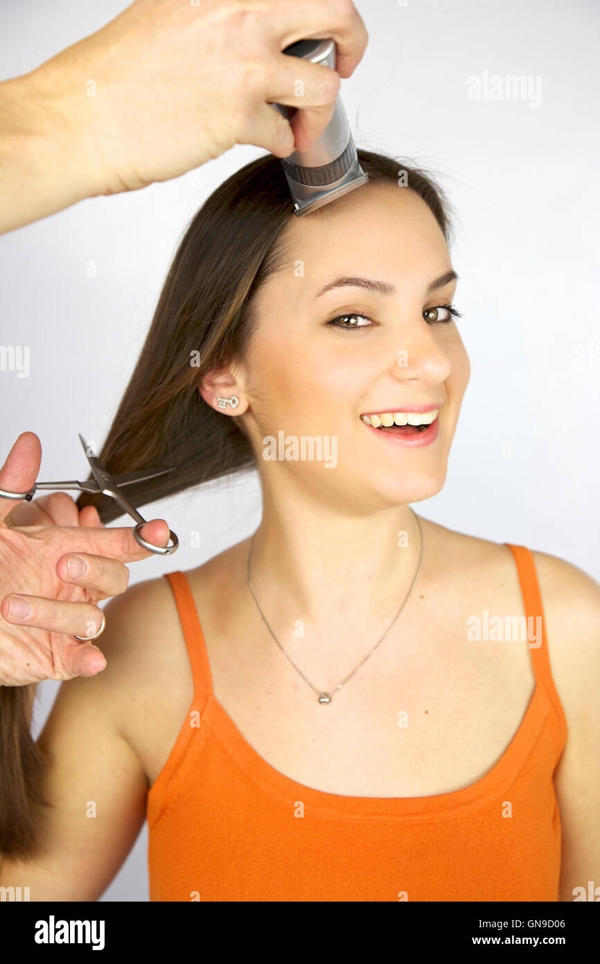 Cutting long hair with scissors Stock Photo - Alamy
