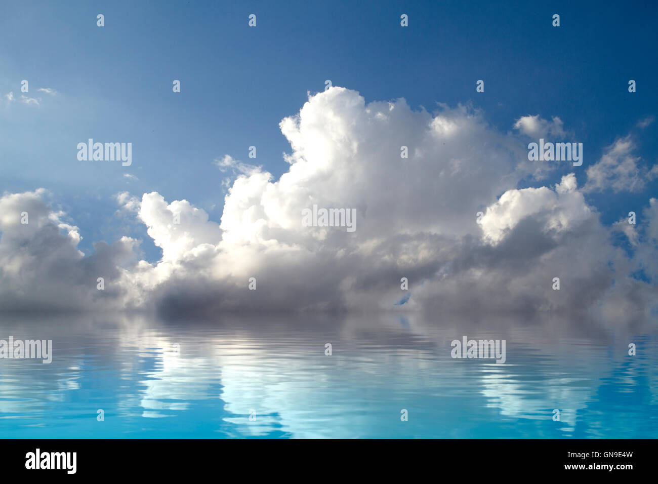 Blue sky and white clouds with reflection in water Stock Photo - Alamy