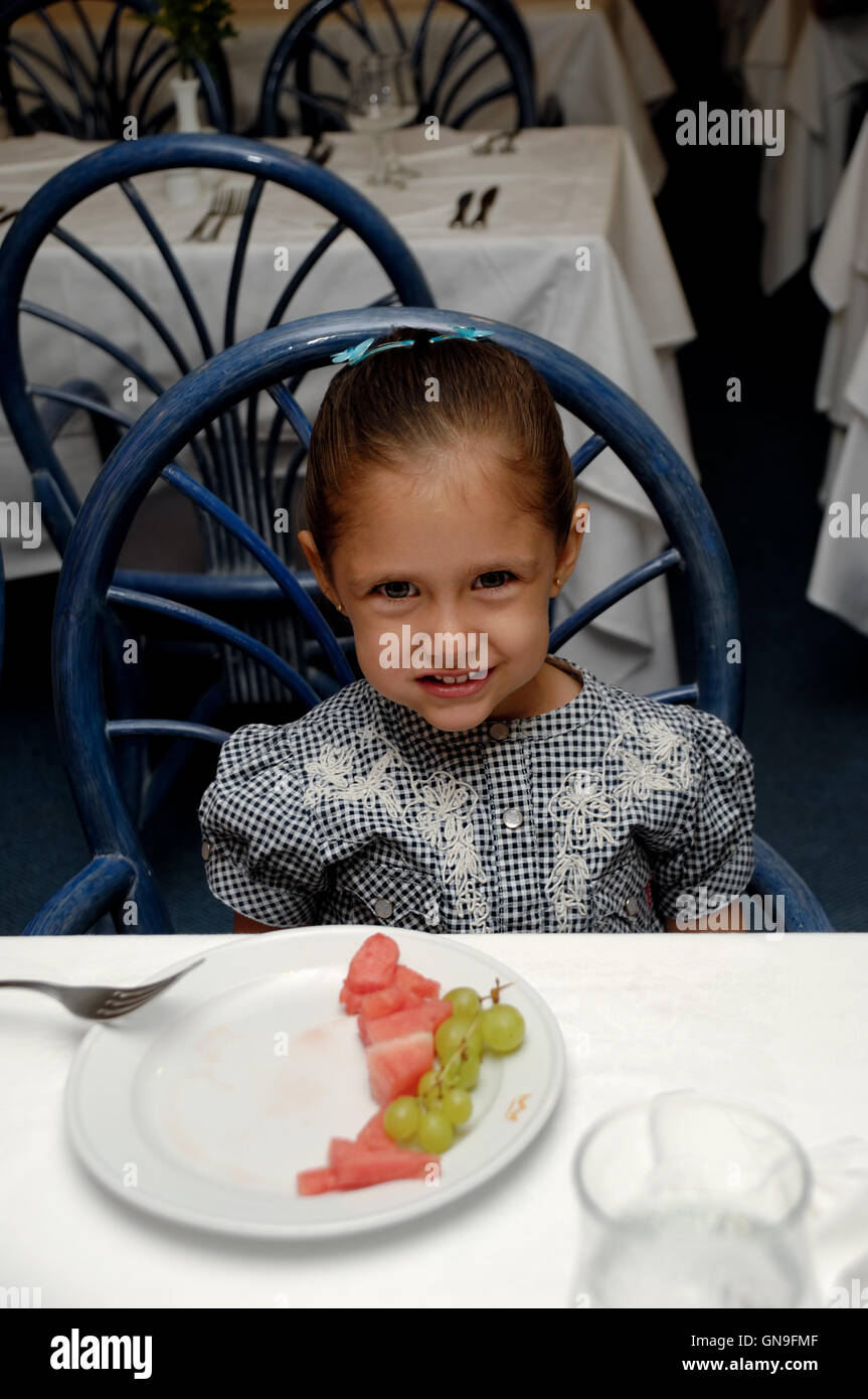 child at restaurant table Stock Photo - Alamy