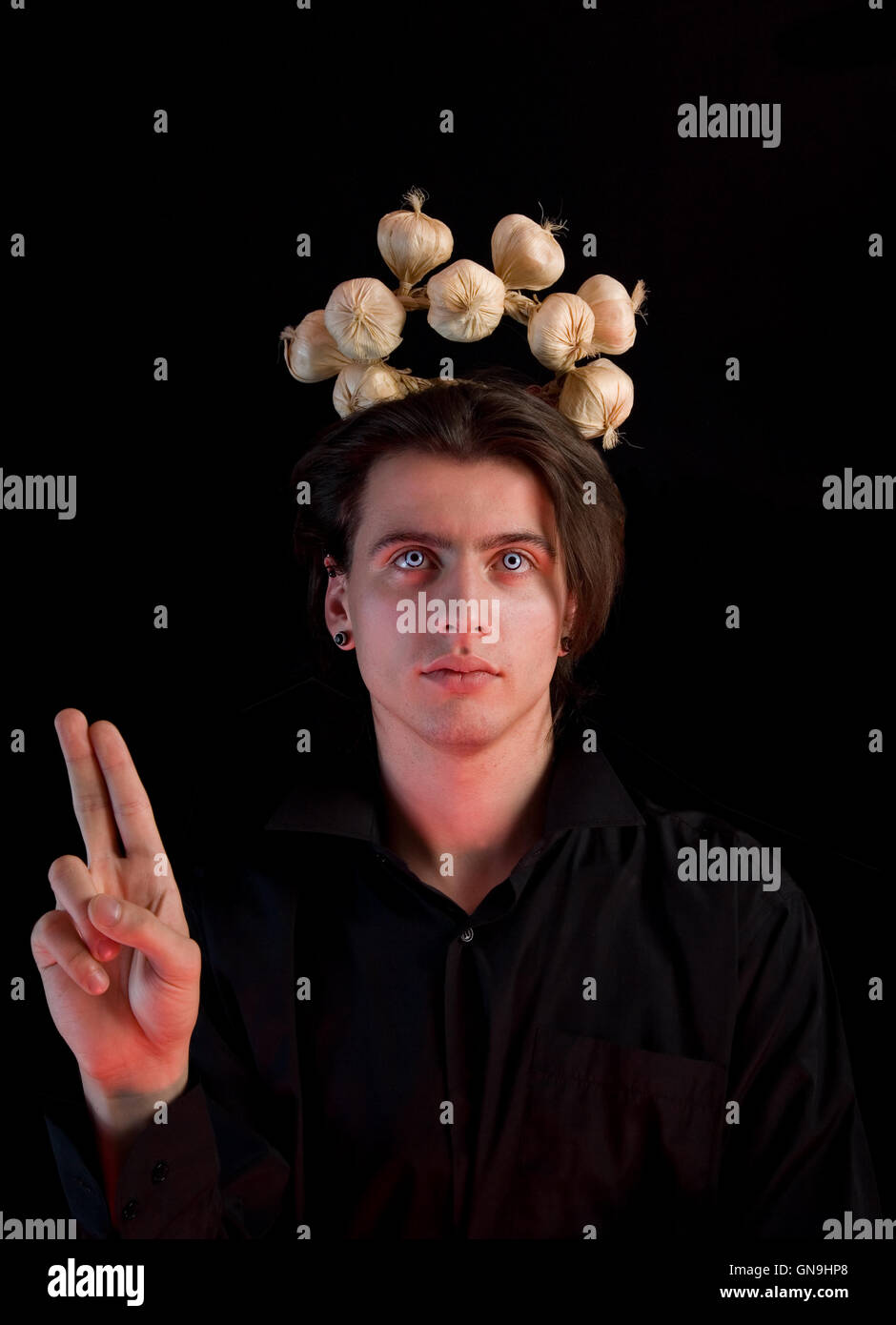 Saint Vampire with garlic halo Stock Photo - Alamy