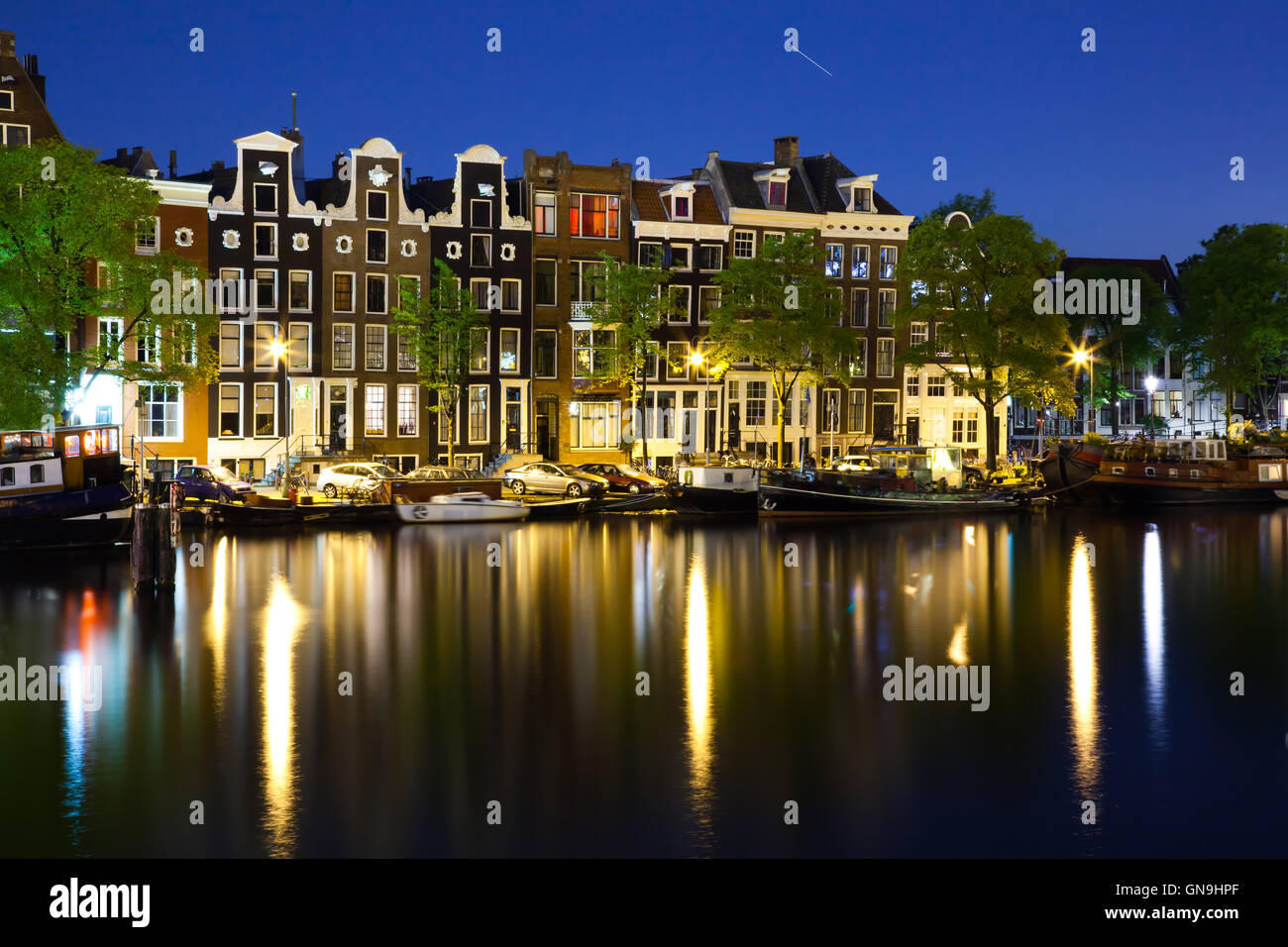 colorful houses in Amsterdam at night Stock Photo - Alamy