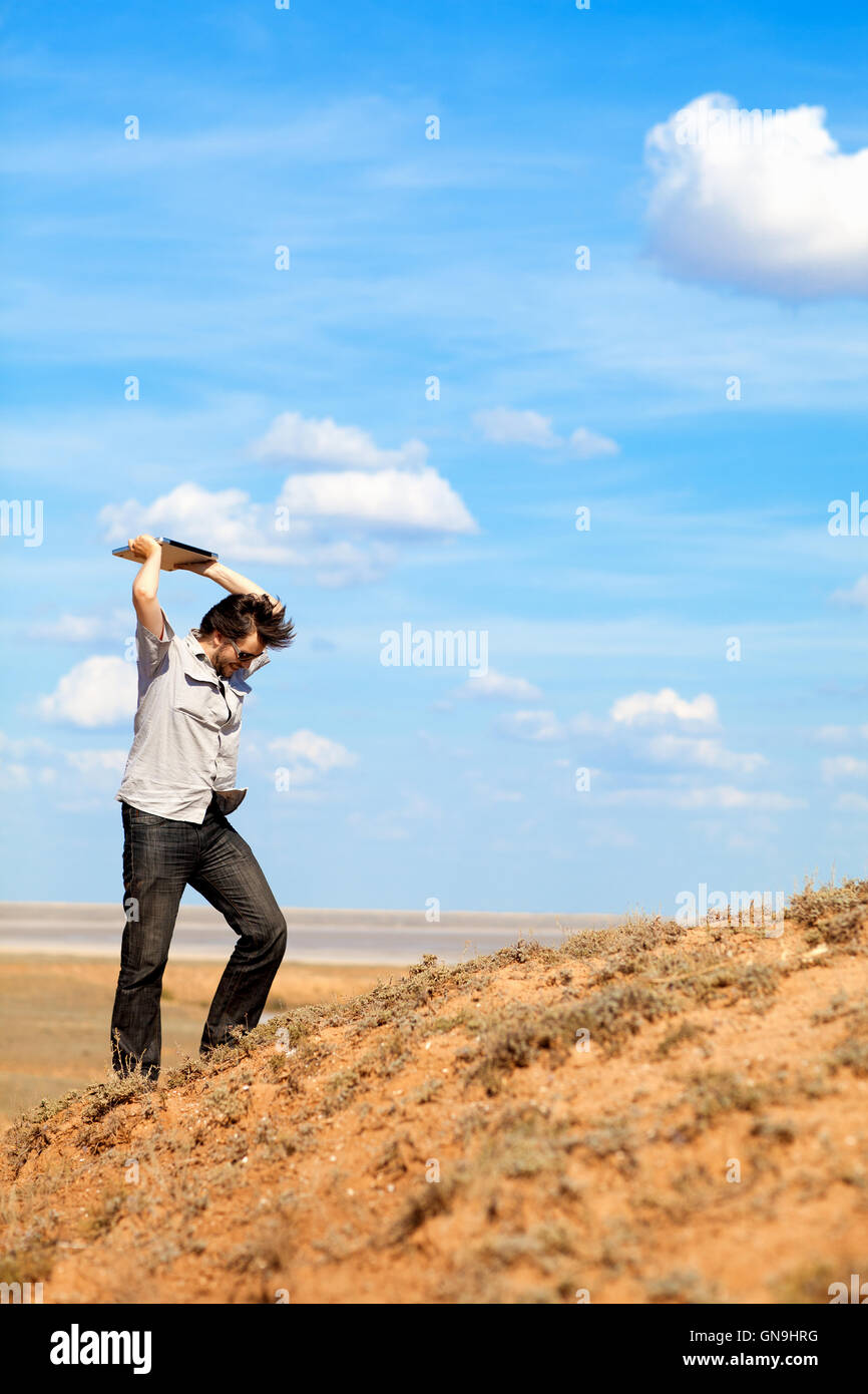 Man throwing laptop outdoors hi-res stock photography and images - Alamy
