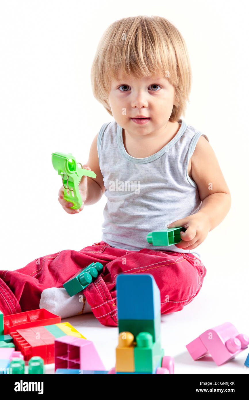 Cute little boy playing with blocks Stock Photo - Alamy