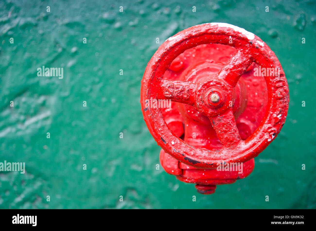 A red wheel valve Stock Photo - Alamy
