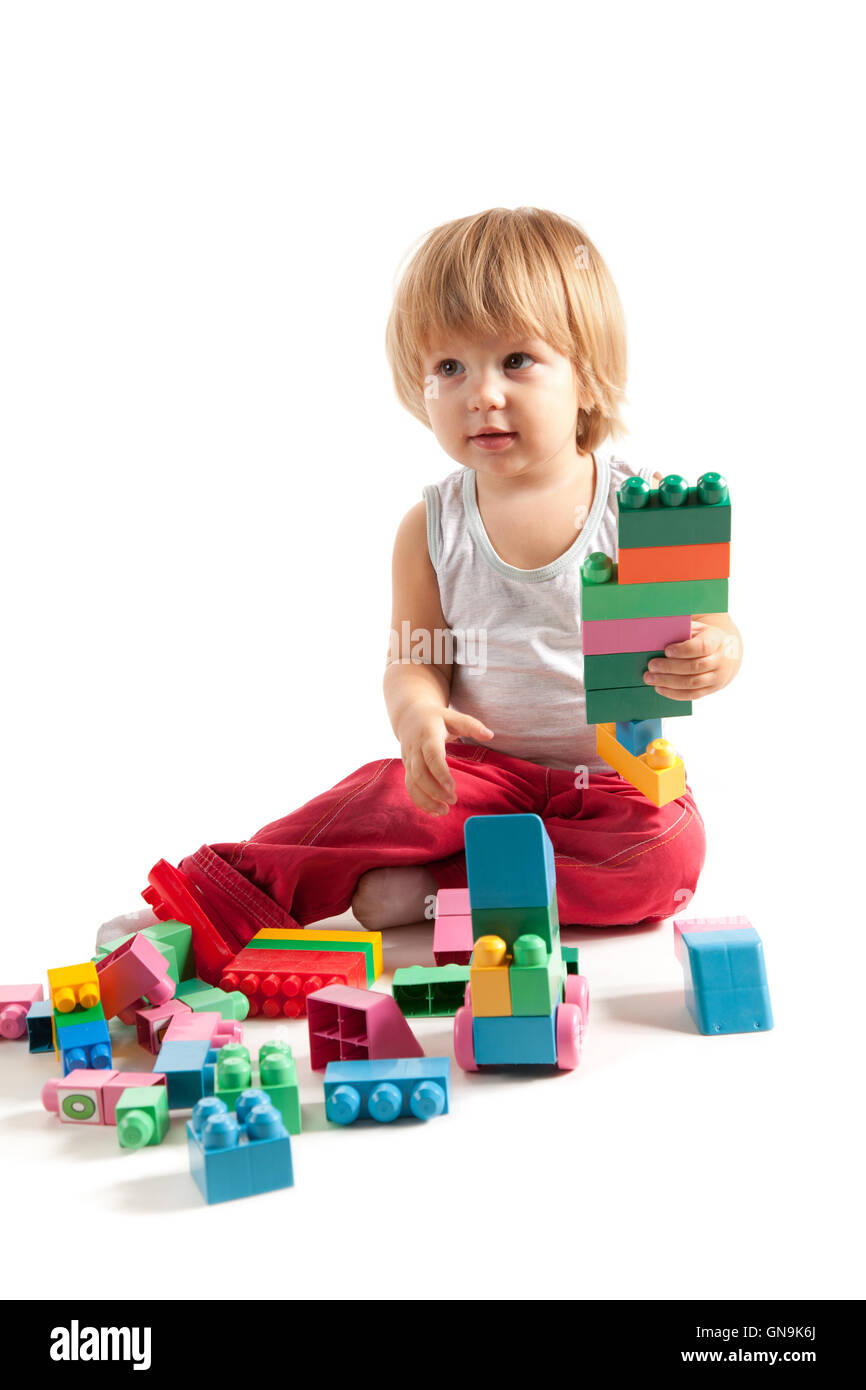 Funny boy playing with blocks Stock Photo - Alamy