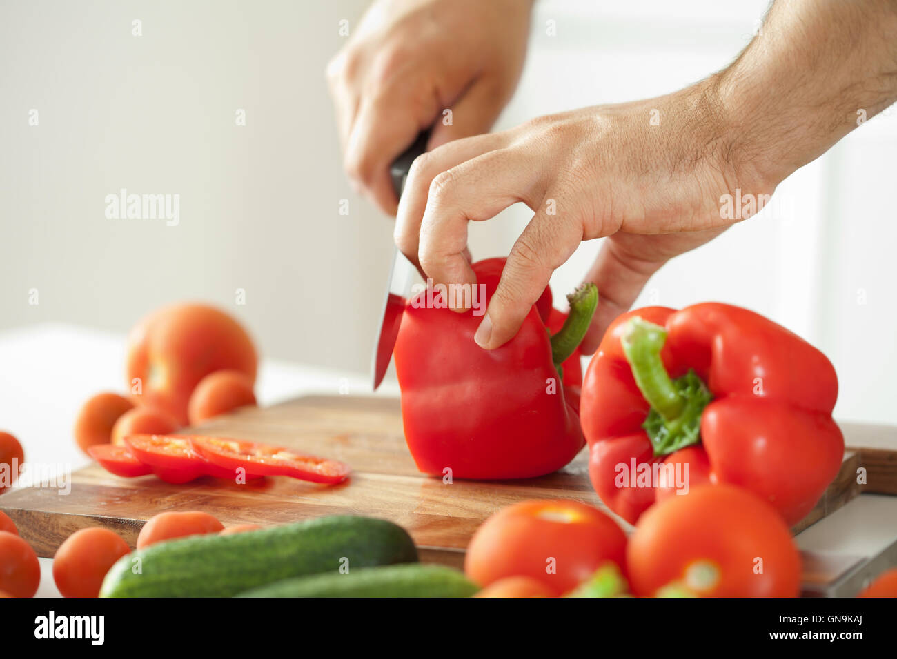 man cutting vegetables for salad Stock Photo - Alamy