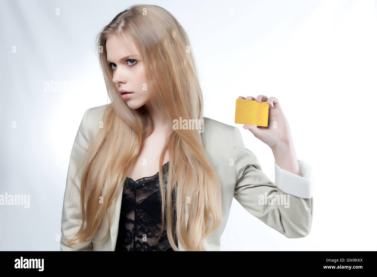 beautiful girl show golden credit card Stock Photo - Alamy