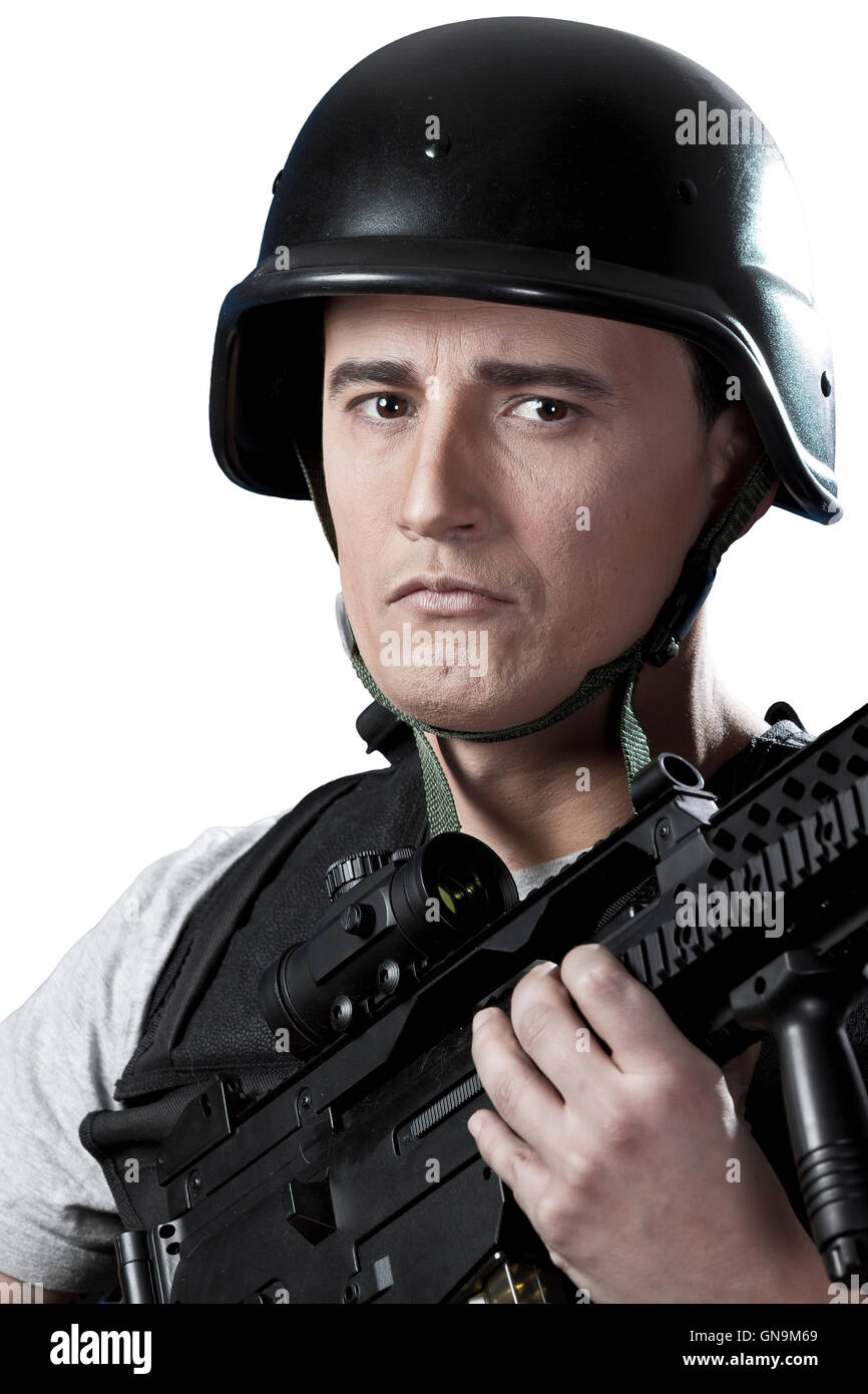 Armed military in protective cask with a weapon Stock Photo - Alamy