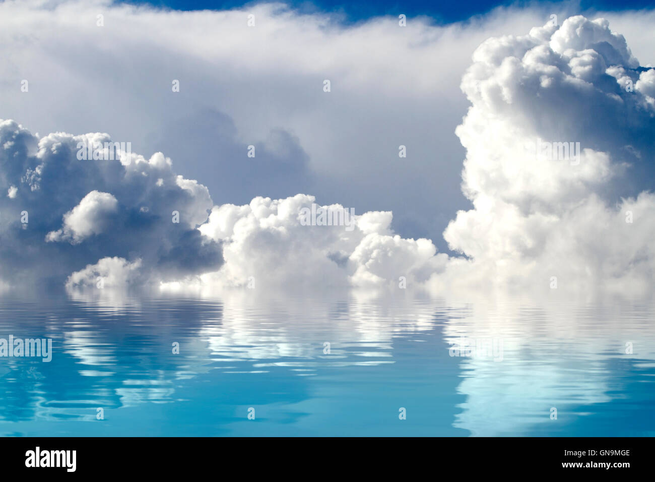 A sky of clouds reflected in a calm sea Stock Photo - Alamy