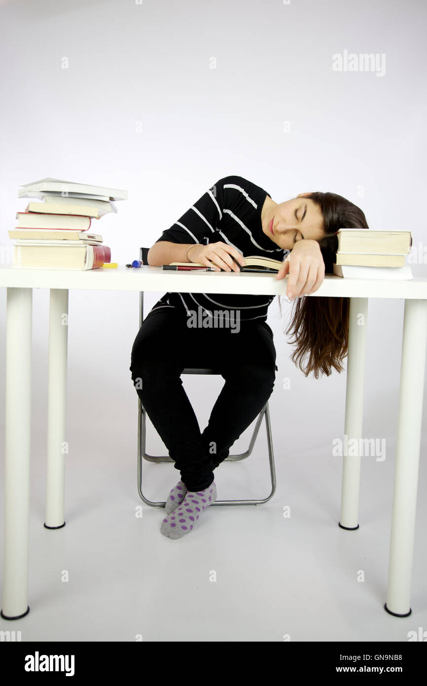 Girl sleeping while studying sitting Stock Photo - Alamy