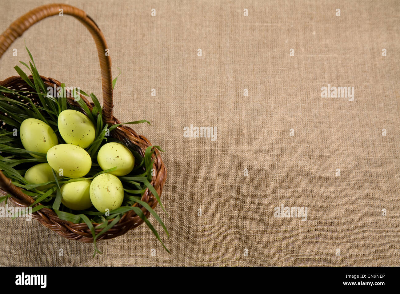Basket with Easter eggs in grass Stock Photo - Alamy