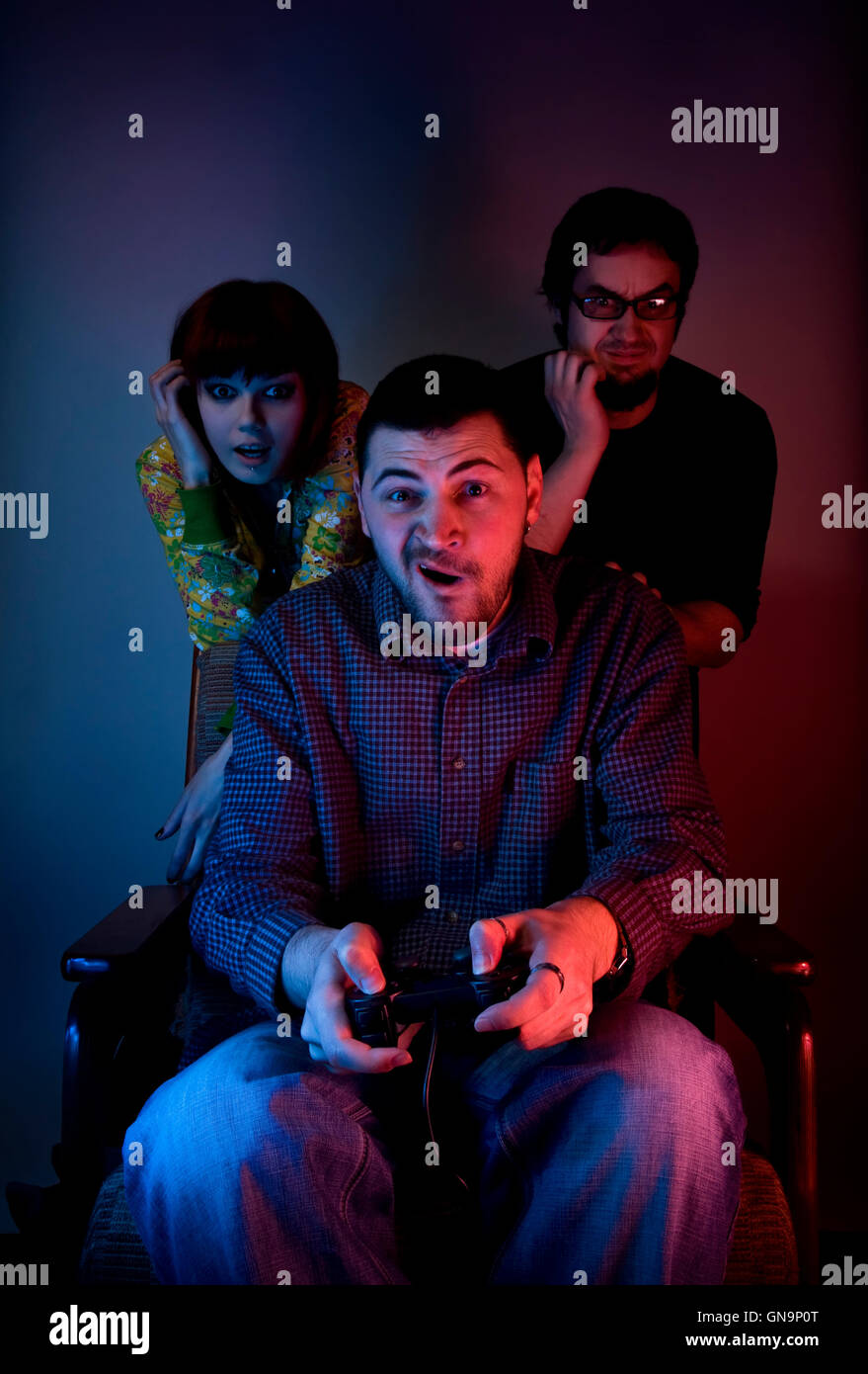 Friends playing video games Stock Photo - Alamy