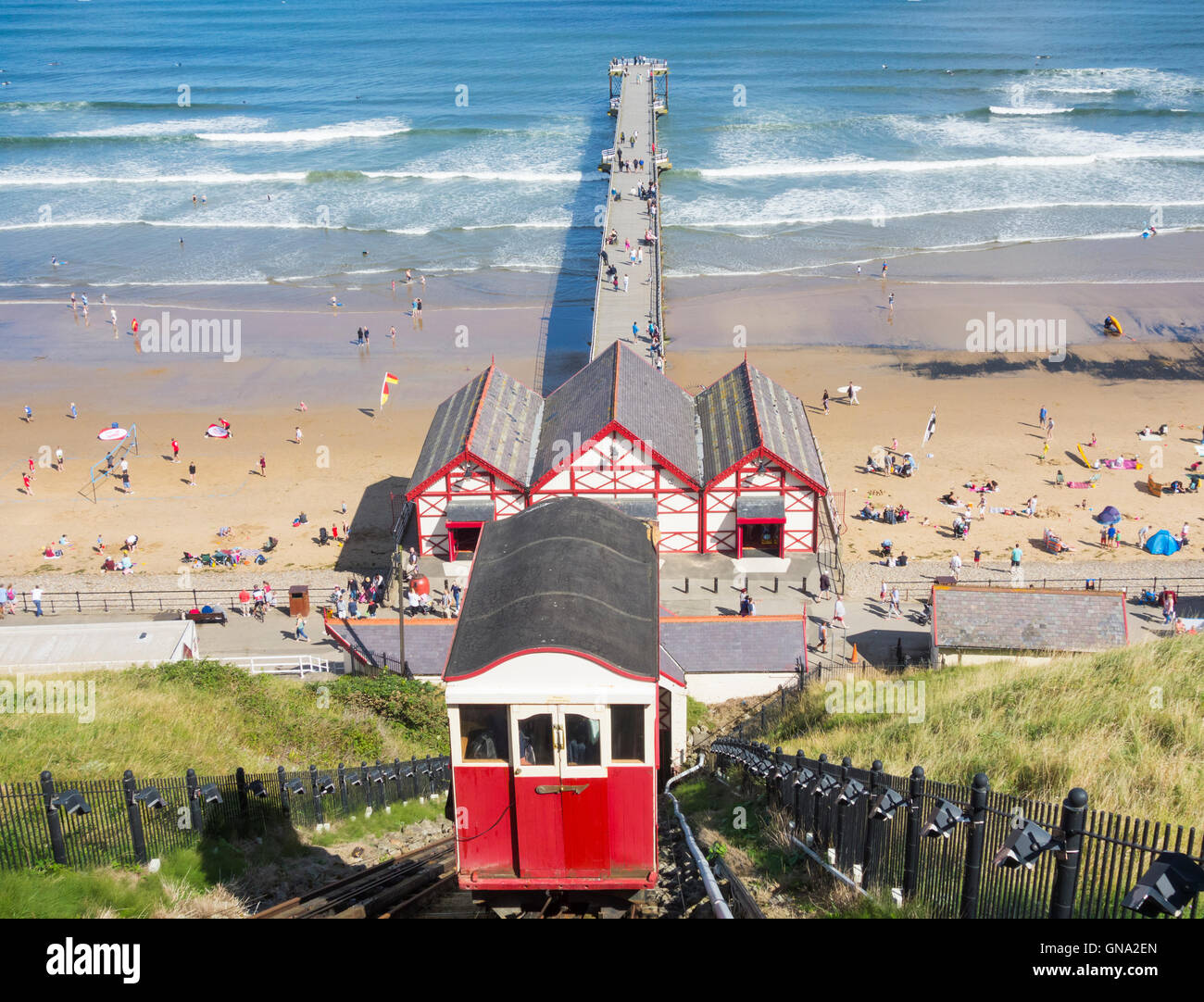 View over Saltburn beach, Victorian pier and cliff tramway from top ...