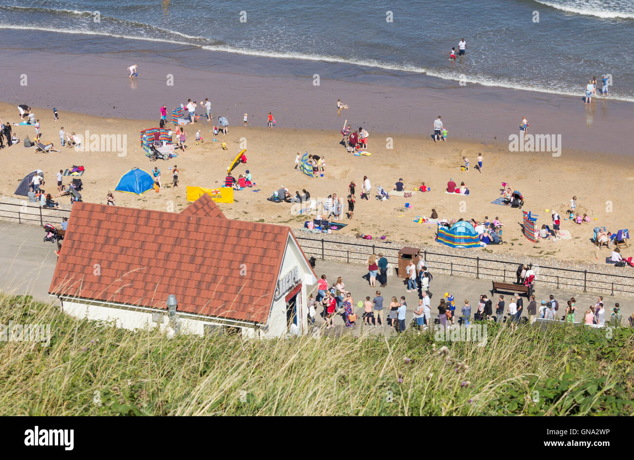 People queuing for fish and chips on lower promenade Saltburn by the ...