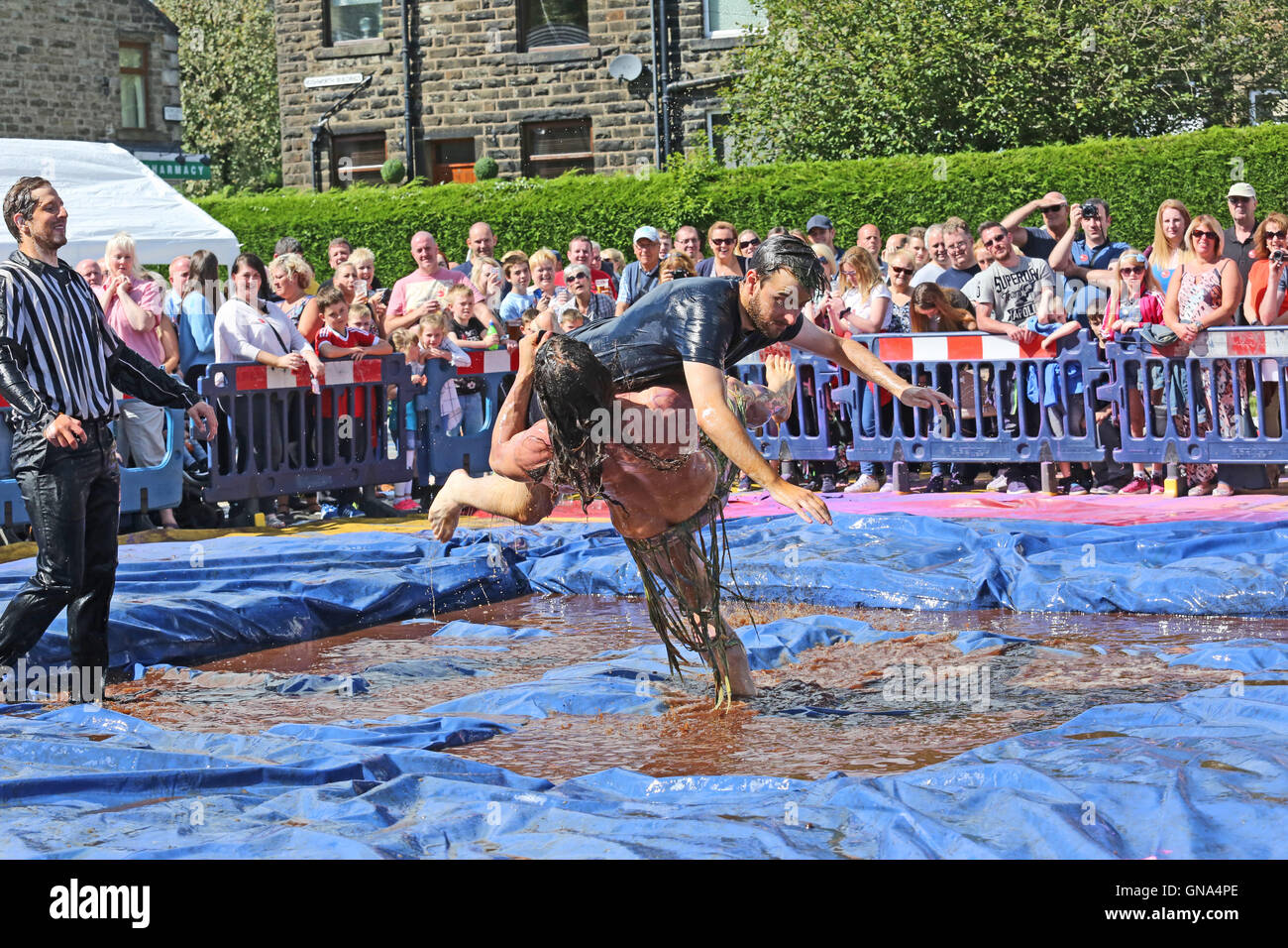 Stacksteads, Lancashire, UK. 29th August, 2016. A wrestler jumps on his ...