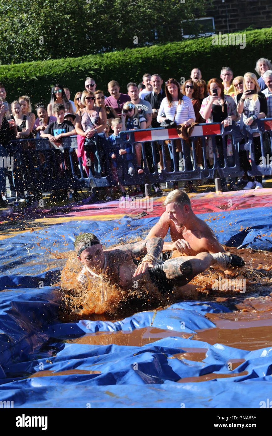 Men wrestling in gravy, Stacksteads,29th August, 2016 Stock Photo - Alamy