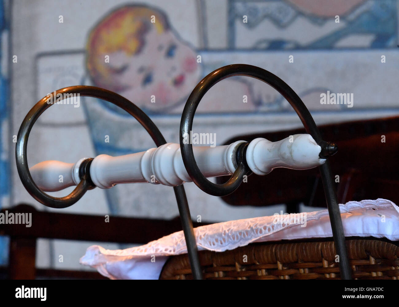 The handles of a doll's pram, produced as they were at the turn of the ...