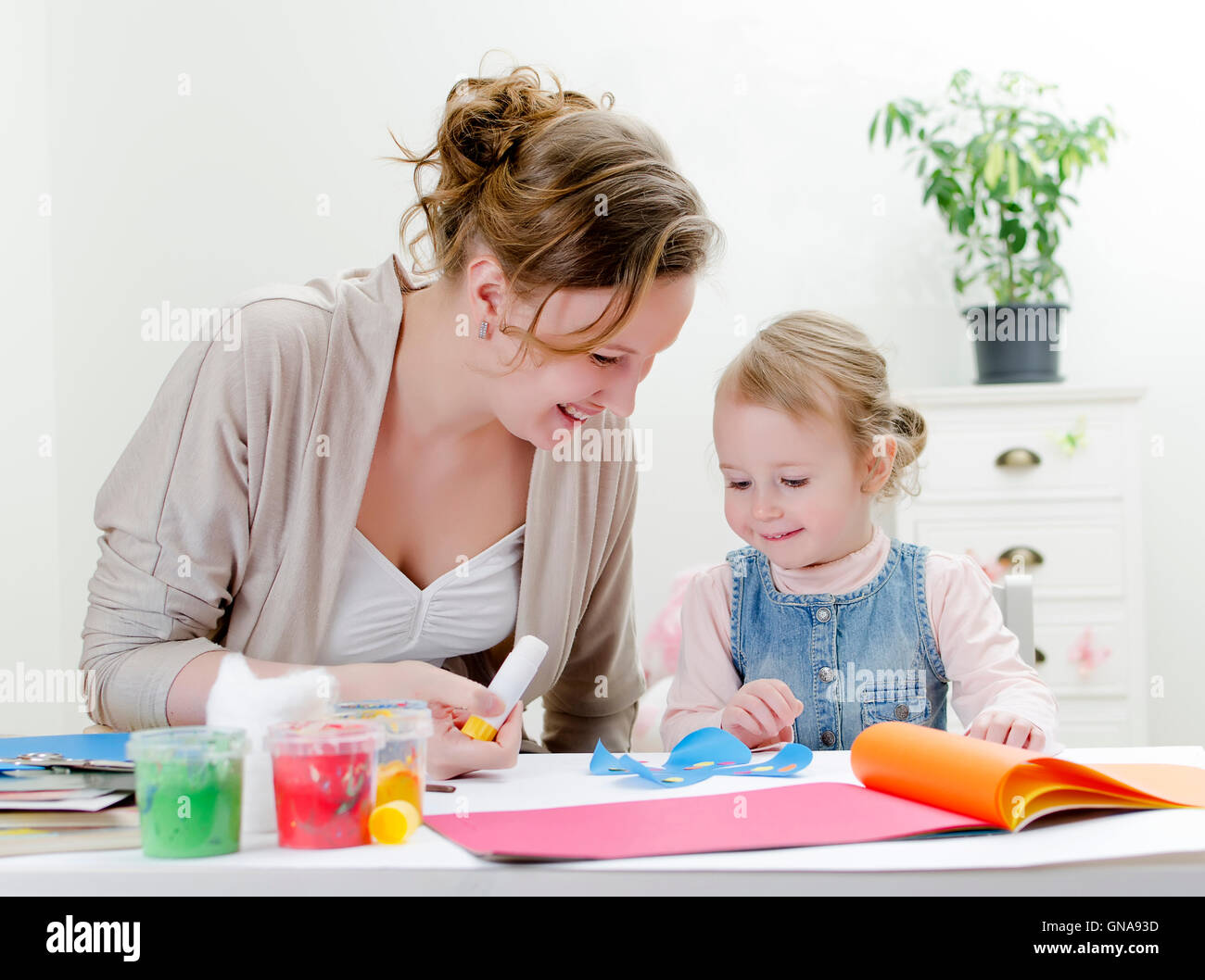 Carving. Mother and daughter doing handicrafts Stock Photo - Alamy