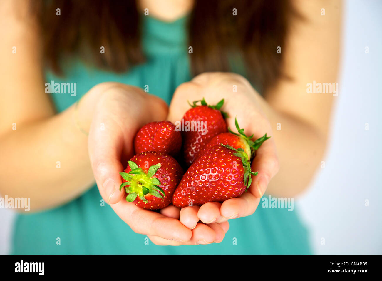 Hands strawberry cut out hi-res stock photography and images - Alamy