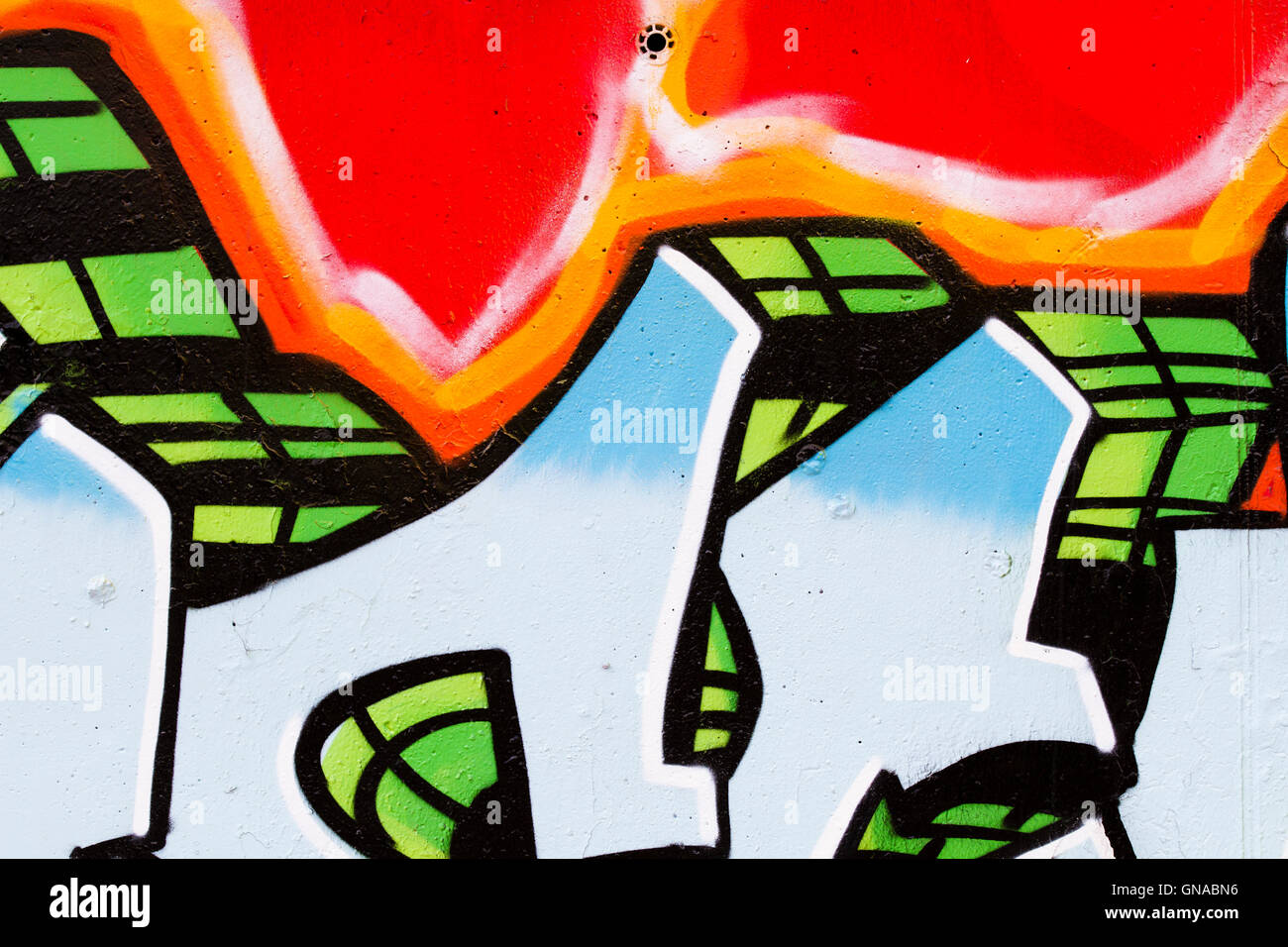 Graffiti on wall, multi colored spray Stock Photo - Alamy